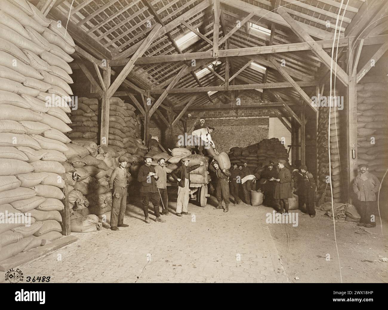 Workers in a warehouse at a coffee roasting plant in Essomes, Marne ...