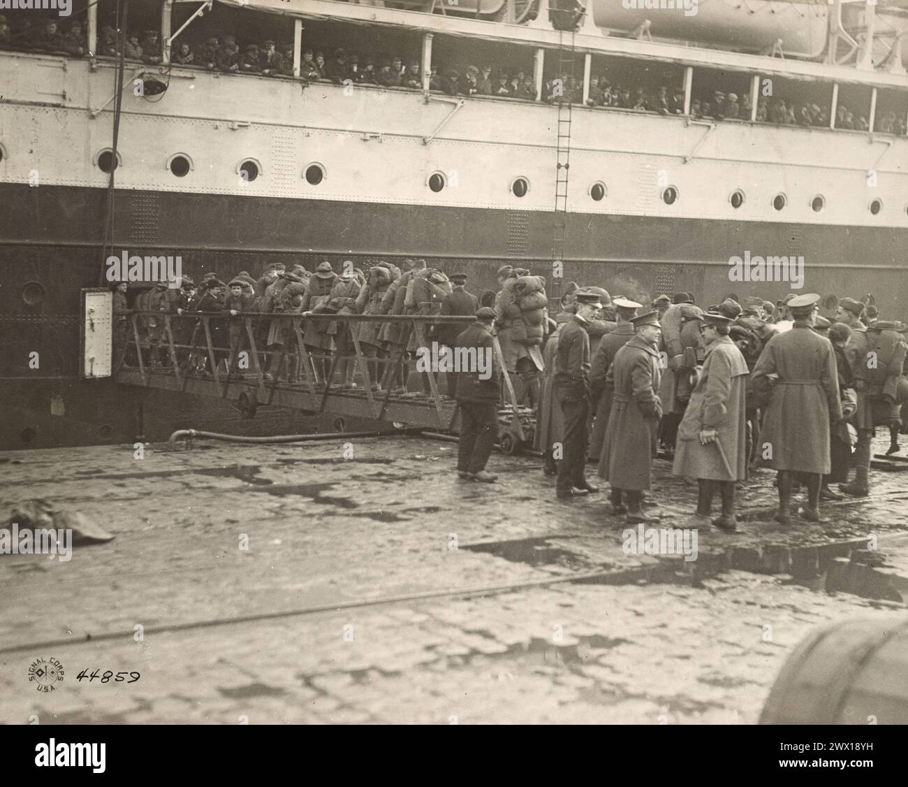 Soldiers from the 337th field artillery, 88th division, file aboard ...