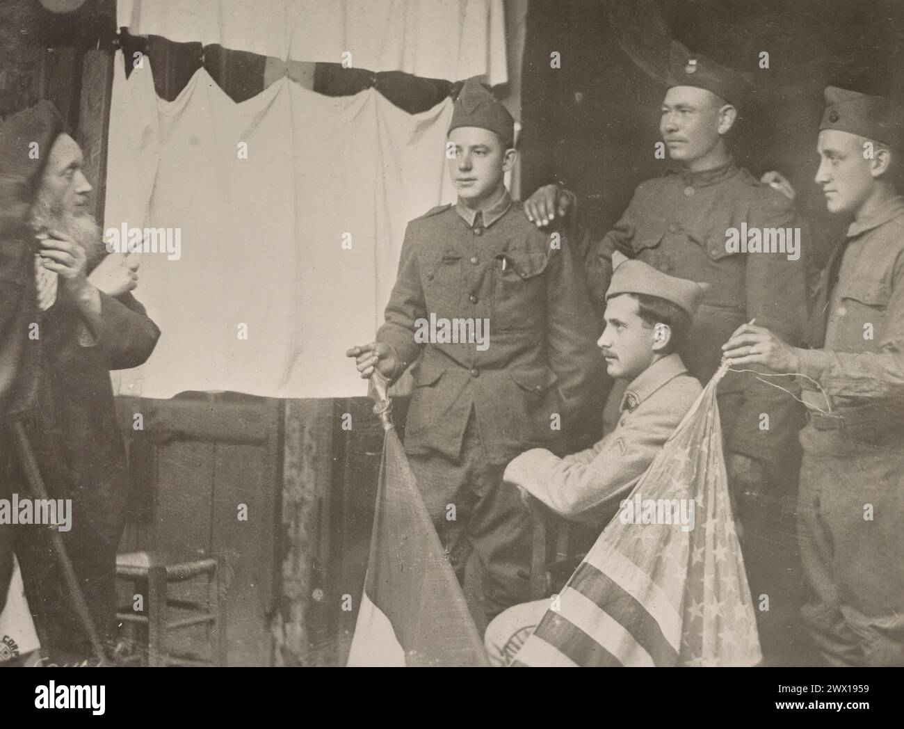 Group of Allied soldiers having their photograph taken by an elderly ...