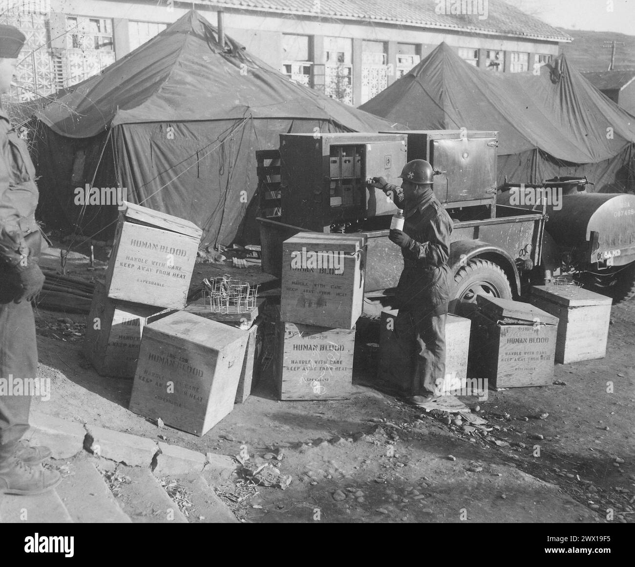 Major Sergeant, George Miller selects human blood for patient at the ...