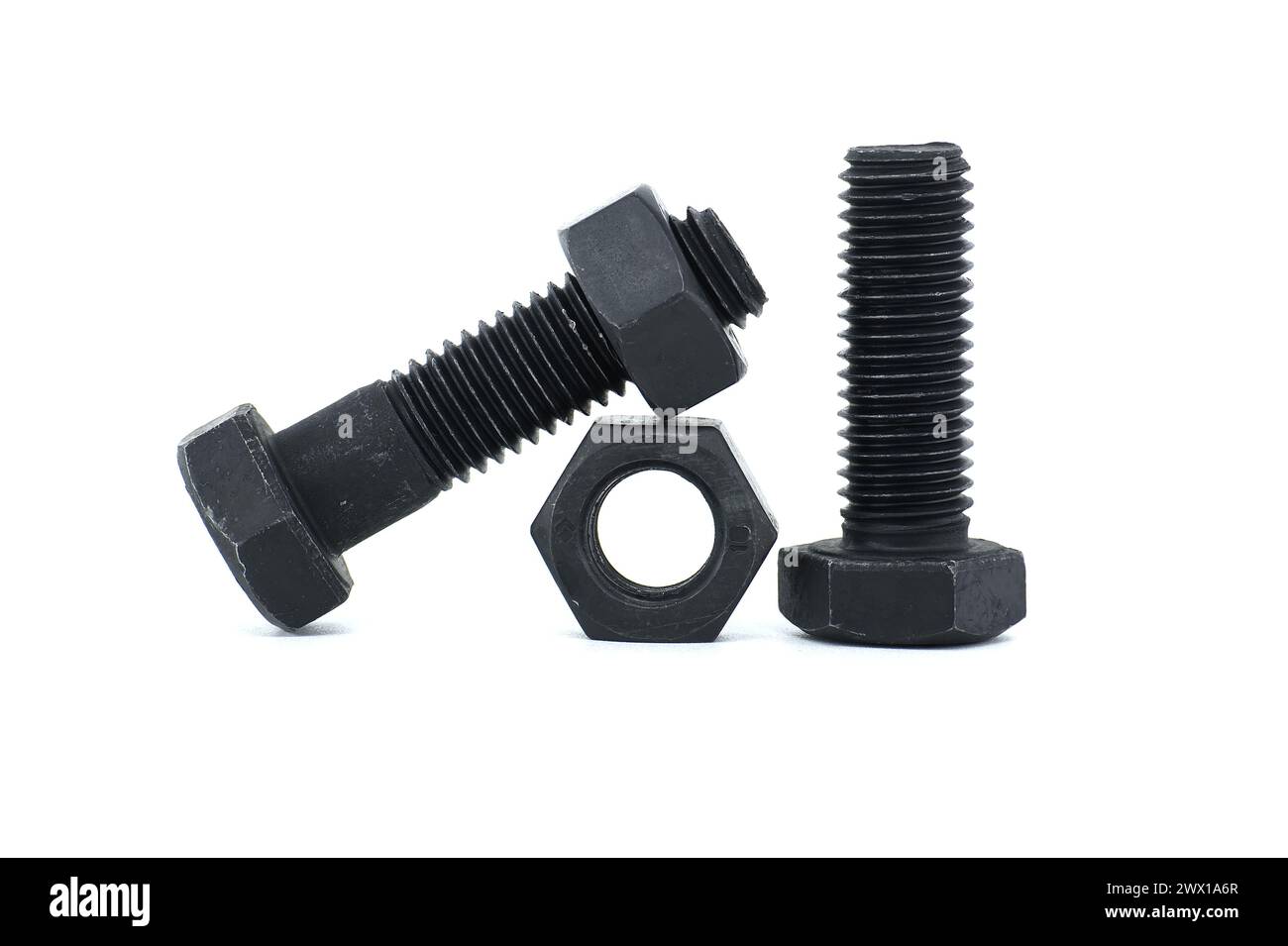 Black metal hexagonal bolts and nuts shown in close-up isolated on ...