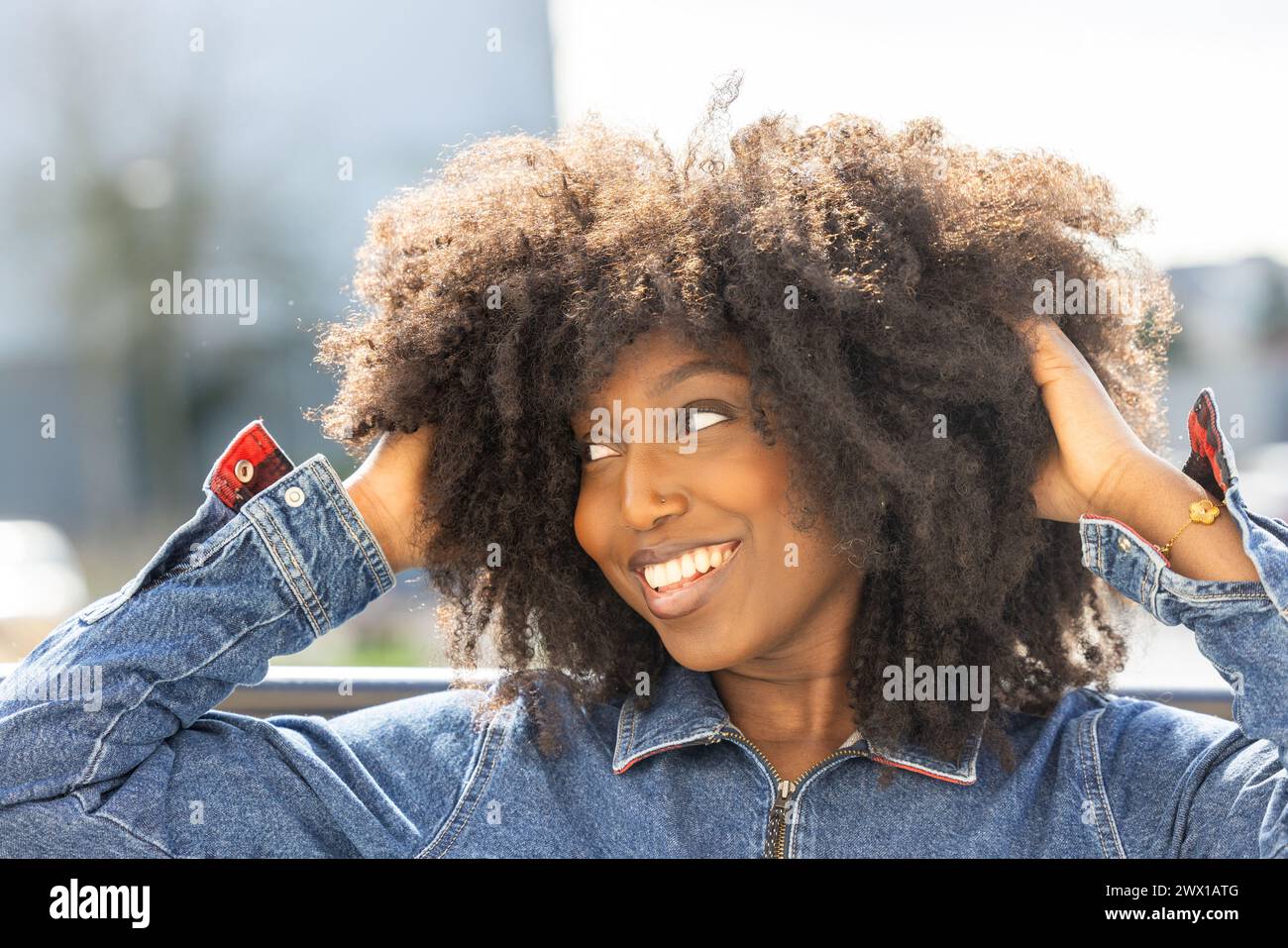 An exuberant African American woman with a radiant smile and a stunning ...