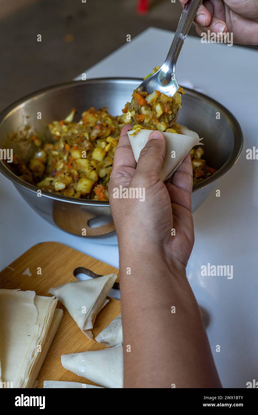 Burmese immigrants from Karen region in Myanmar preparing traditional ...