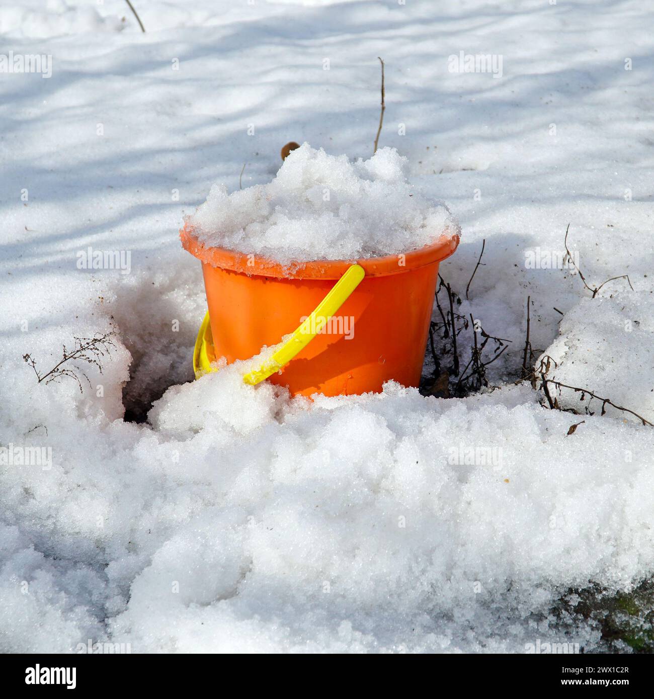 Melting snow in a bucket Stock Photo - Alamy