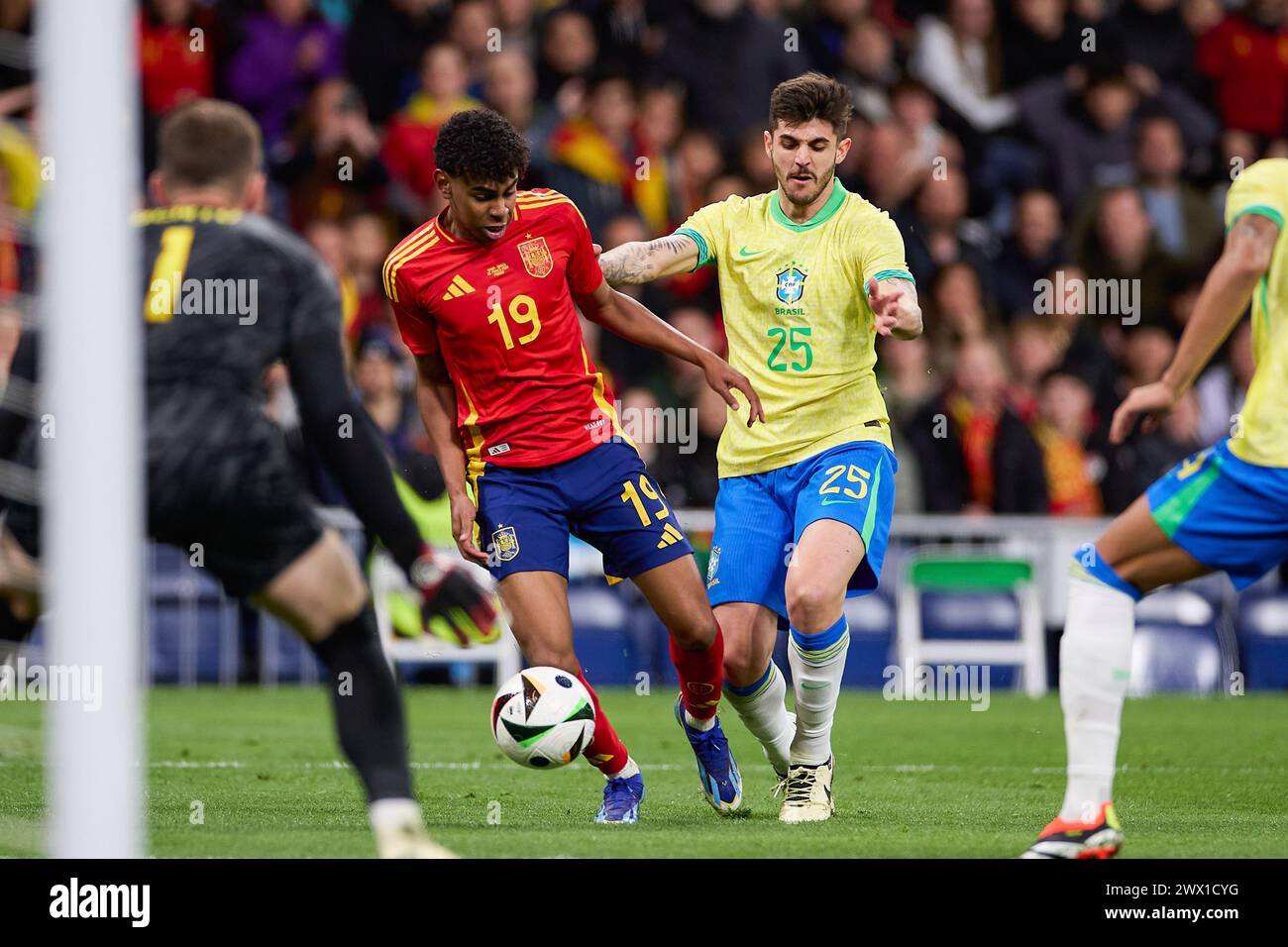 Madrid, Spain. 26th Mar, 2024. Lamine Yamal (L) of Spain with Lucas ...