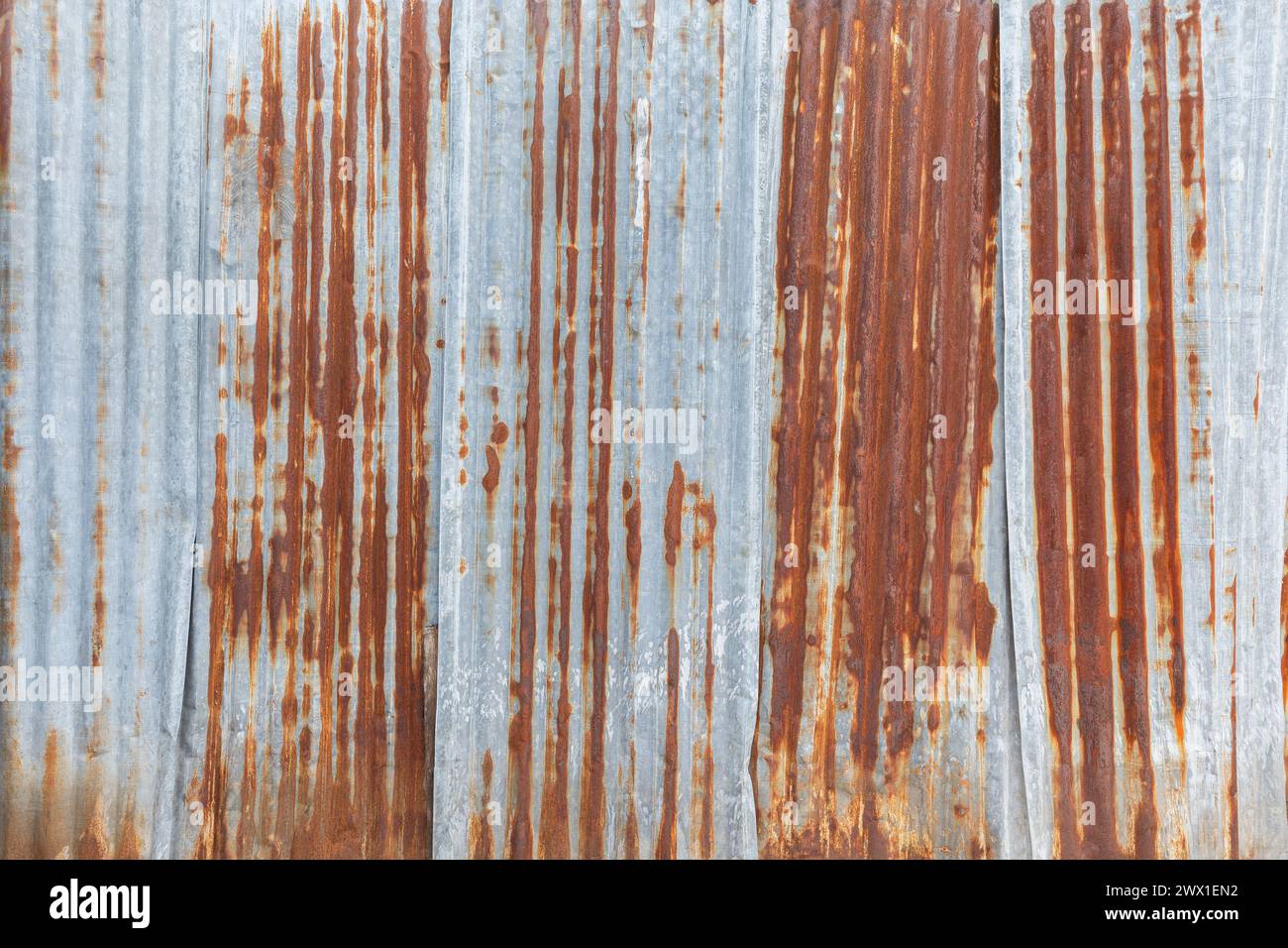 Front view of a rusty and weathered corrugated iron metal construction ...