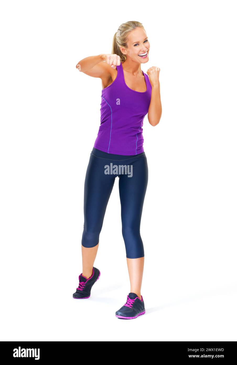 Woman, portrait and boxing punch in studio for workout performance or ...