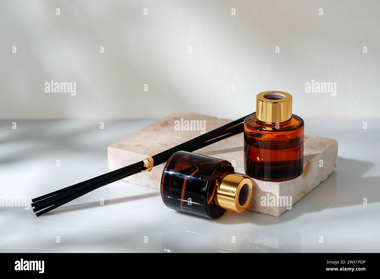 Elegant Aroma Diffuser With Black Reeds on a Marble Stand in Soft ...