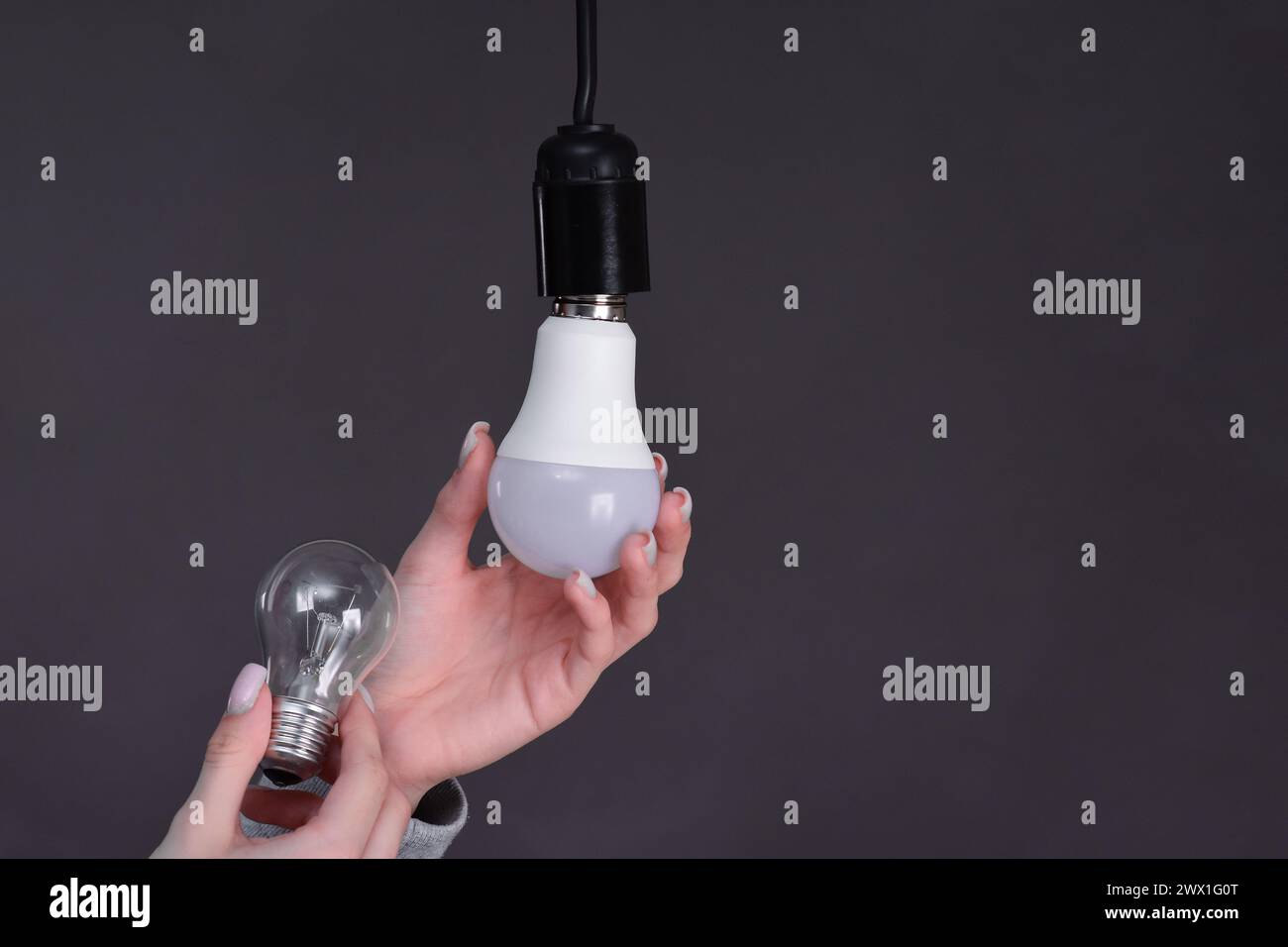 replacing the incandescent light bulb with LED Stock Photo - Alamy