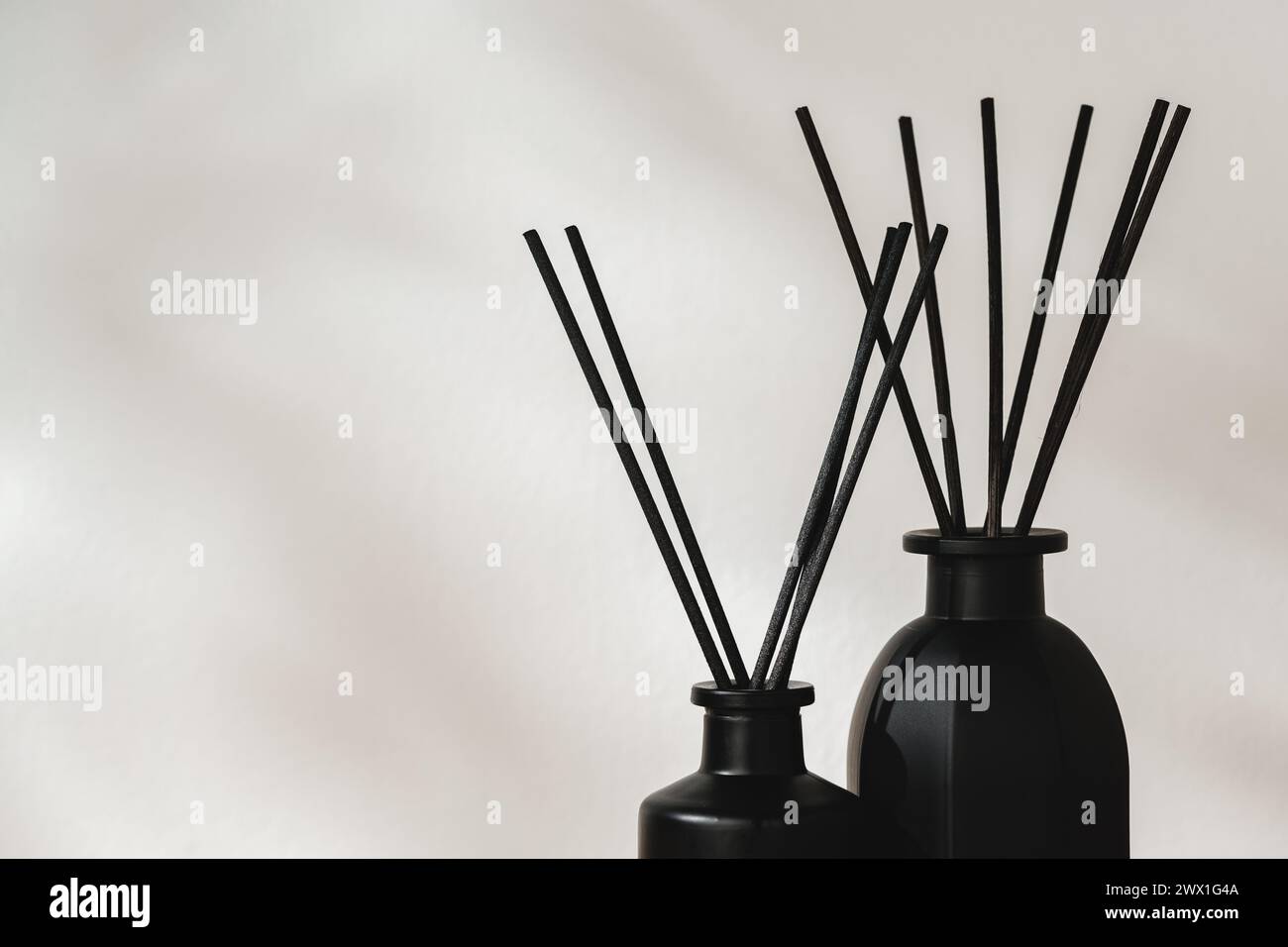 Minimalist Aromatic Reed Diffusers on a Wooden Surface Against a Soft ...