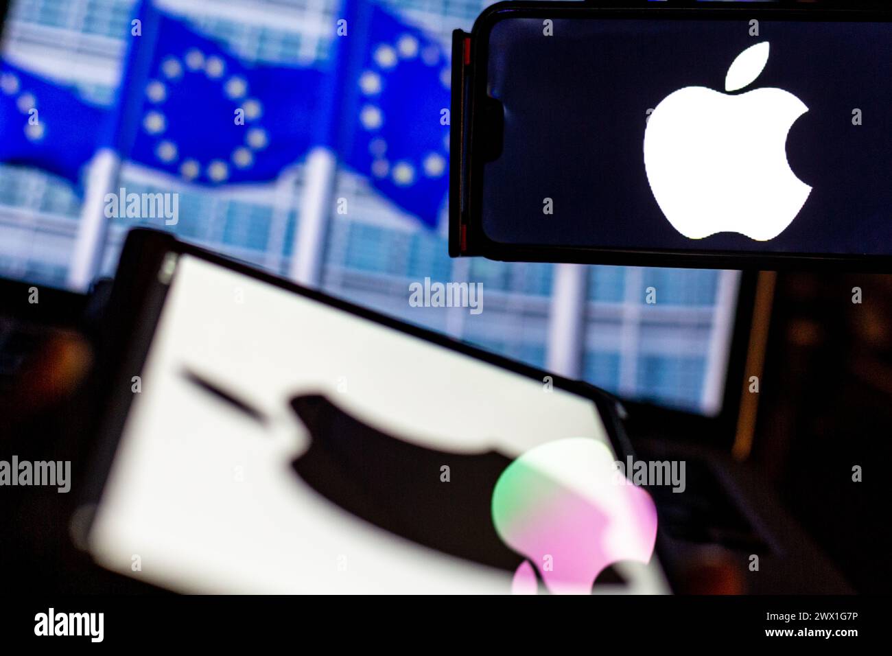 In this photo illustration logo of Apple is seen on a smartphone and ...