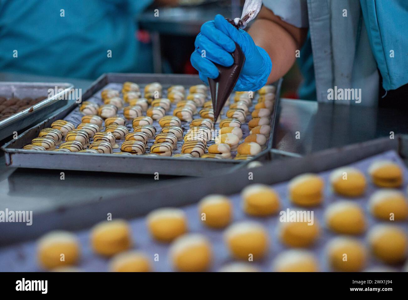 COOKIES PRODUCTION AHEAD OF EID Workers finish making cookies at the J ...