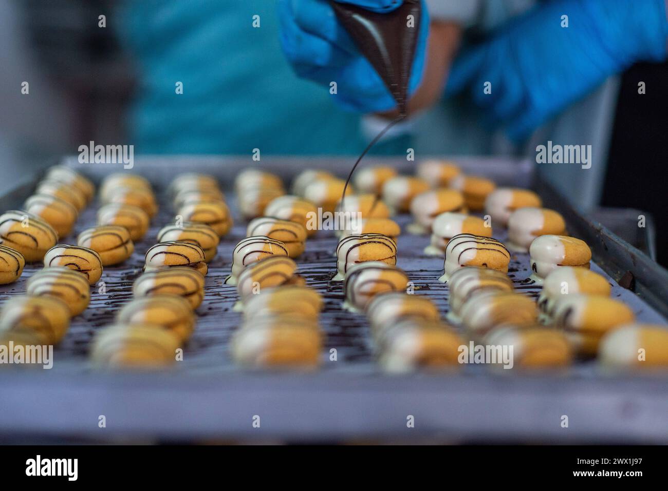 COOKIES PRODUCTION AHEAD OF EID Workers finish making cookies at the J ...