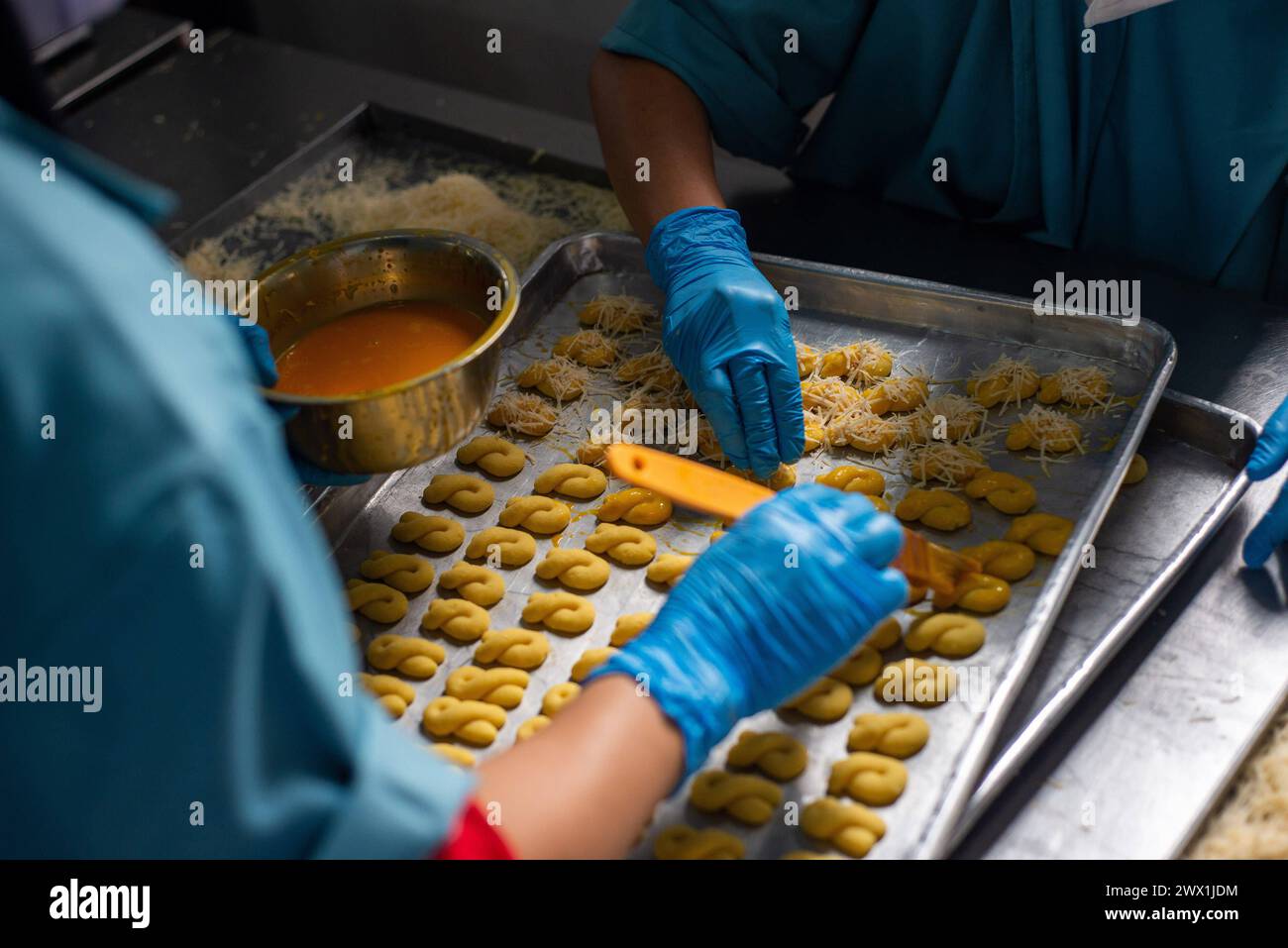 COOKIES PRODUCTION AHEAD OF EID Workers finish making cookies at the J ...