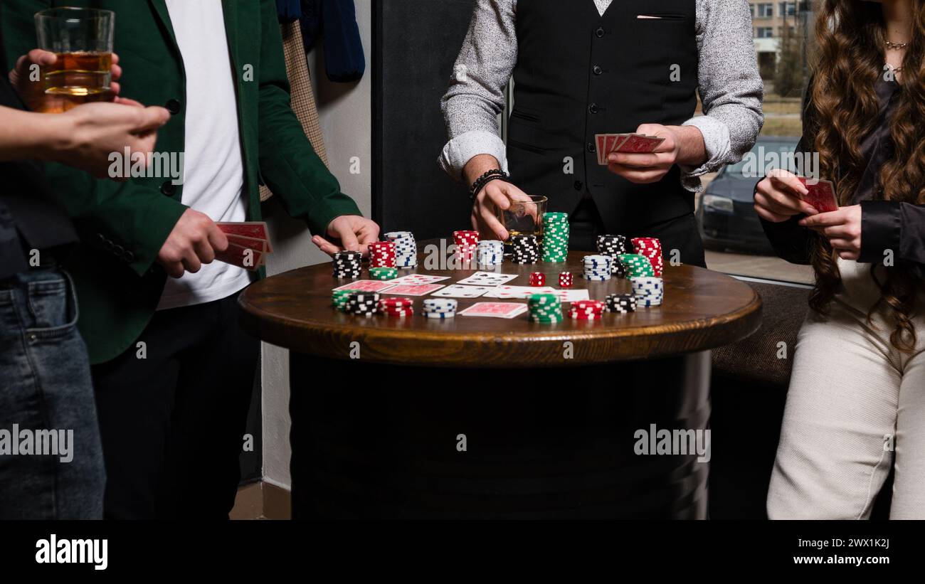 A team of young boys and girls play poker. First-person observation of ...