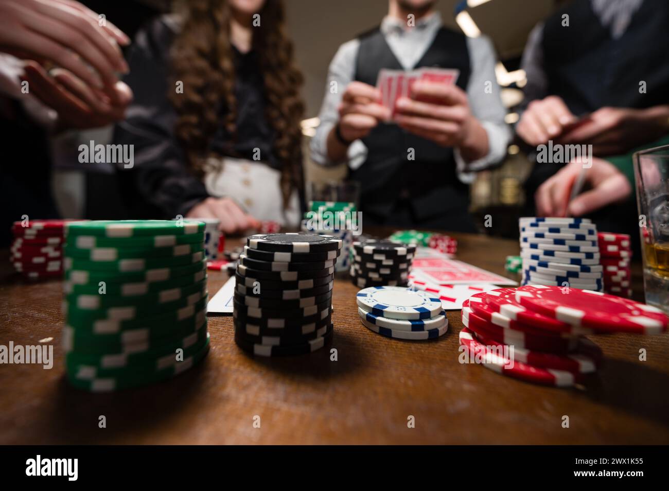 A team of young boys and girls play poker. First-person observation of ...
