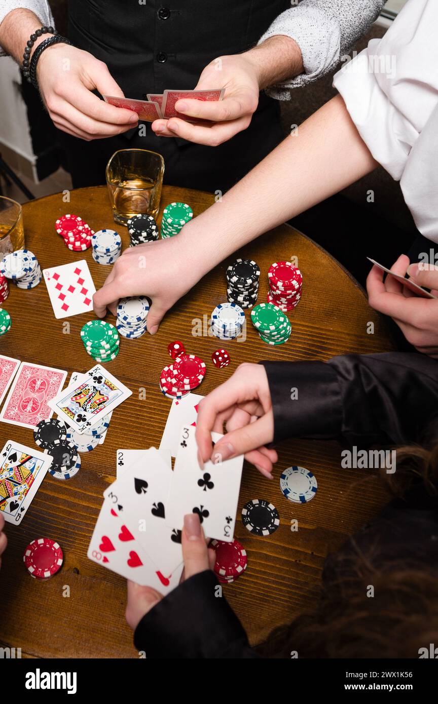 A team of young boys and girls play poker. First-person observation of ...