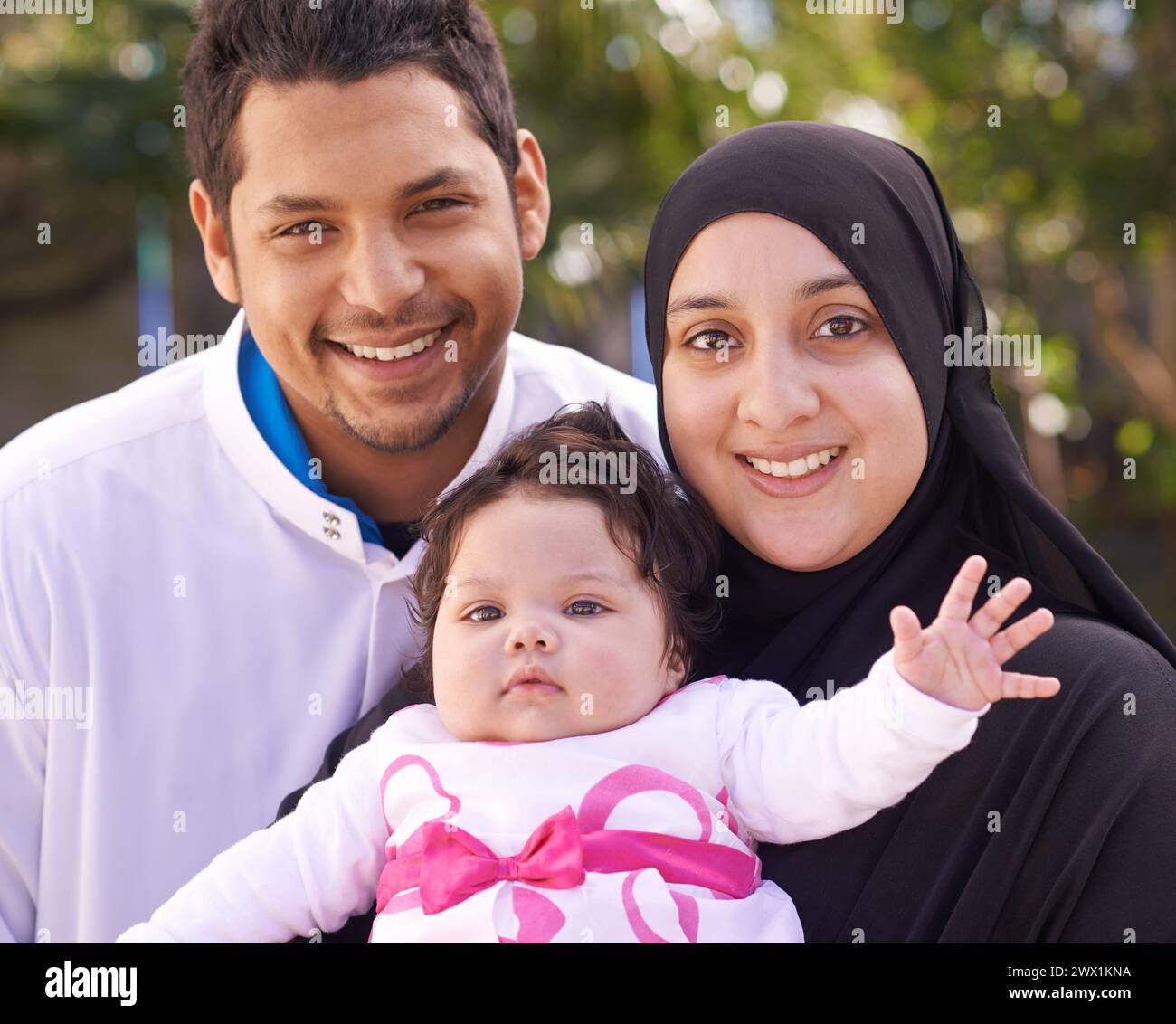 Muslim family, park and portrait of parents with baby for bonding ...