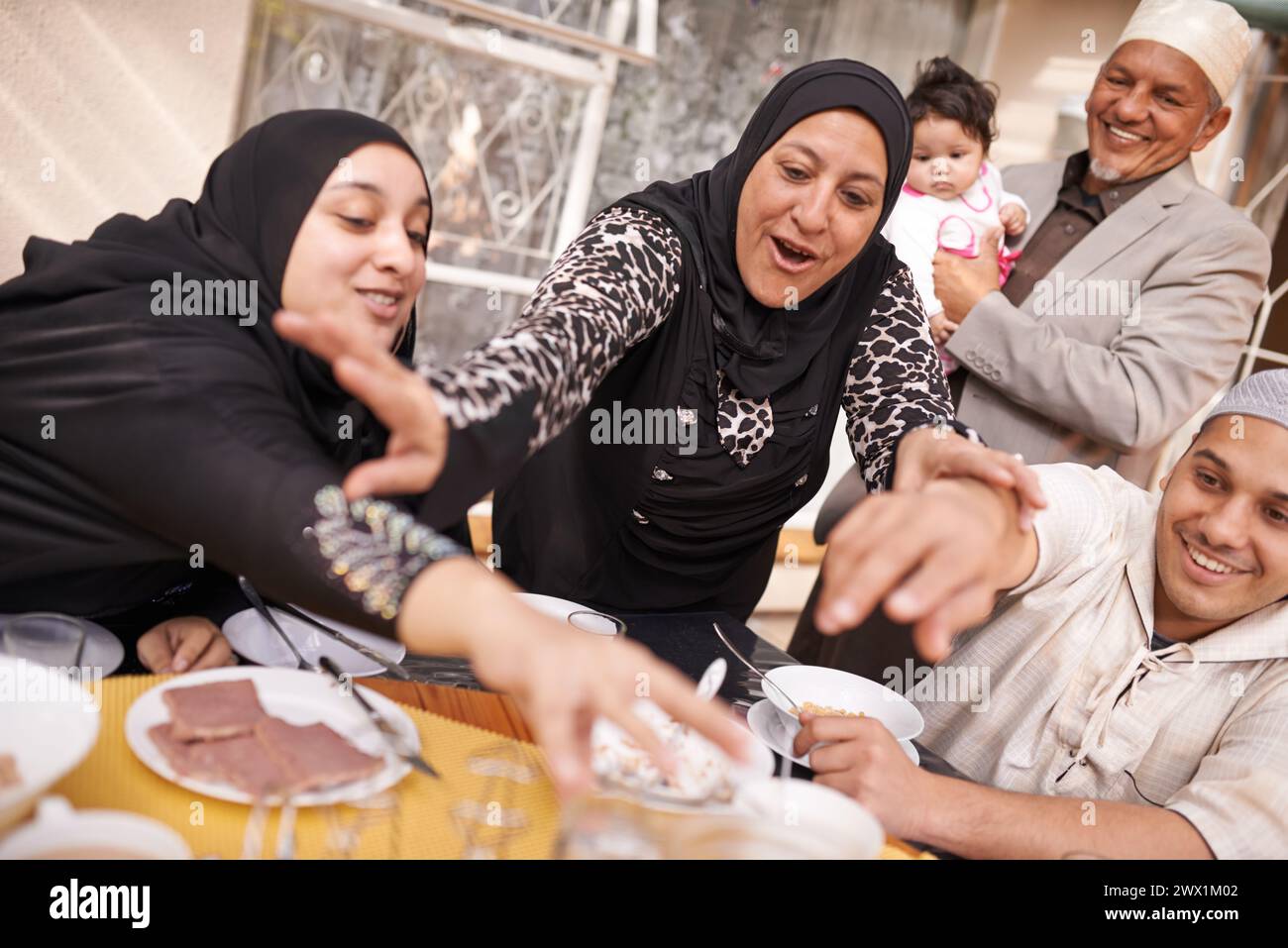 Muslim family, Eid and excited by table with food for eating ...