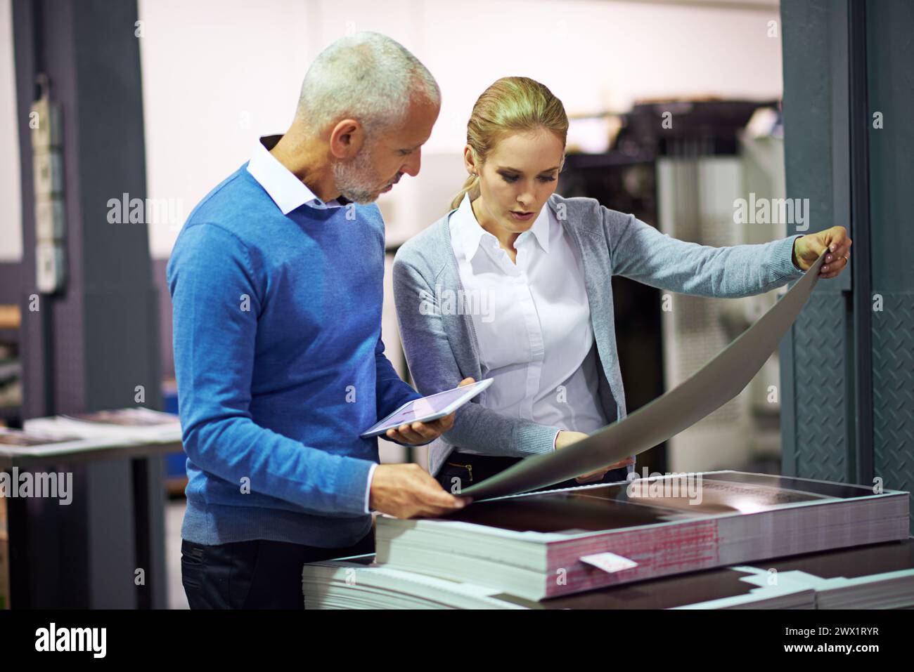 Printing industry, tablet and people with paper for communication in ...