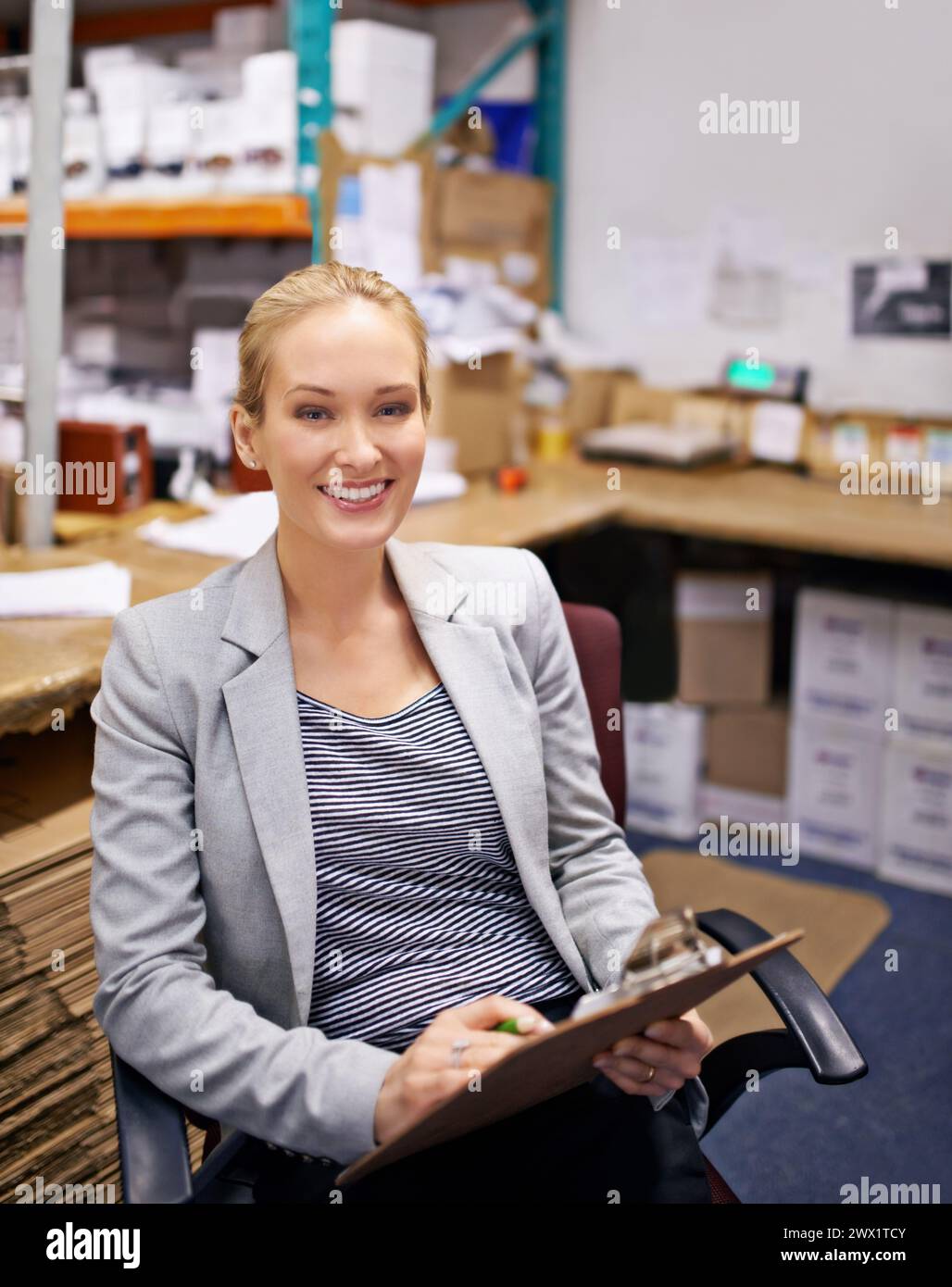 Business woman, portrait and clipboard in warehouse office for ...