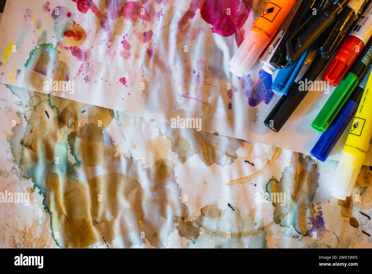 Top view of multicolored watercolor pens with twistable caps placed on ...