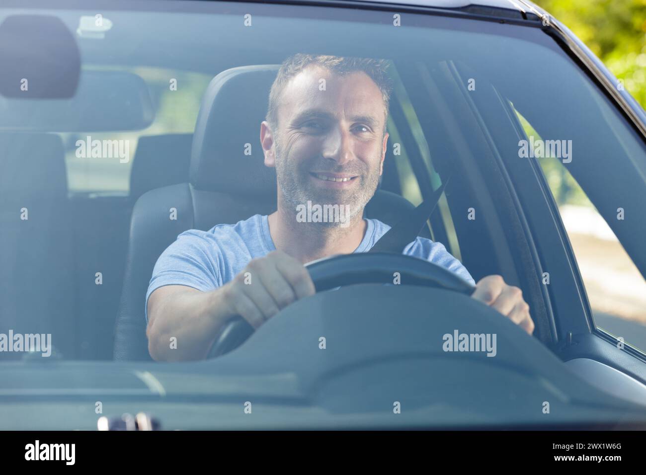 smiling driver inside of his car Stock Photo - Alamy