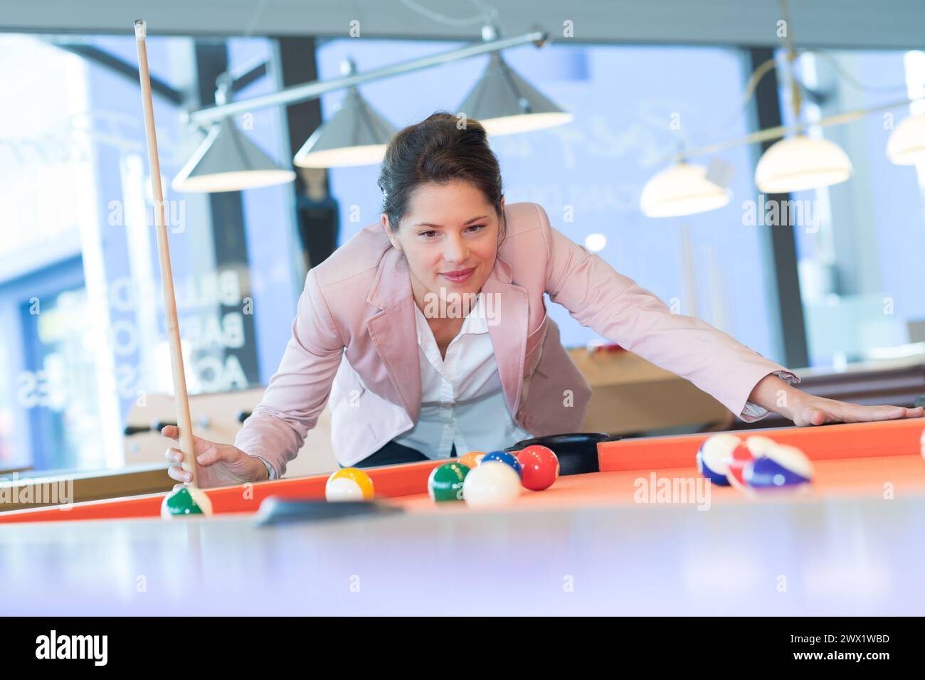portrait of female playing billiard Stock Photo - Alamy