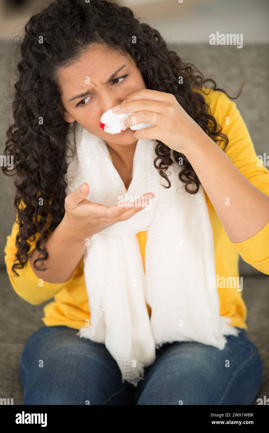 a woman with a bleeding nose Stock Photo - Alamy