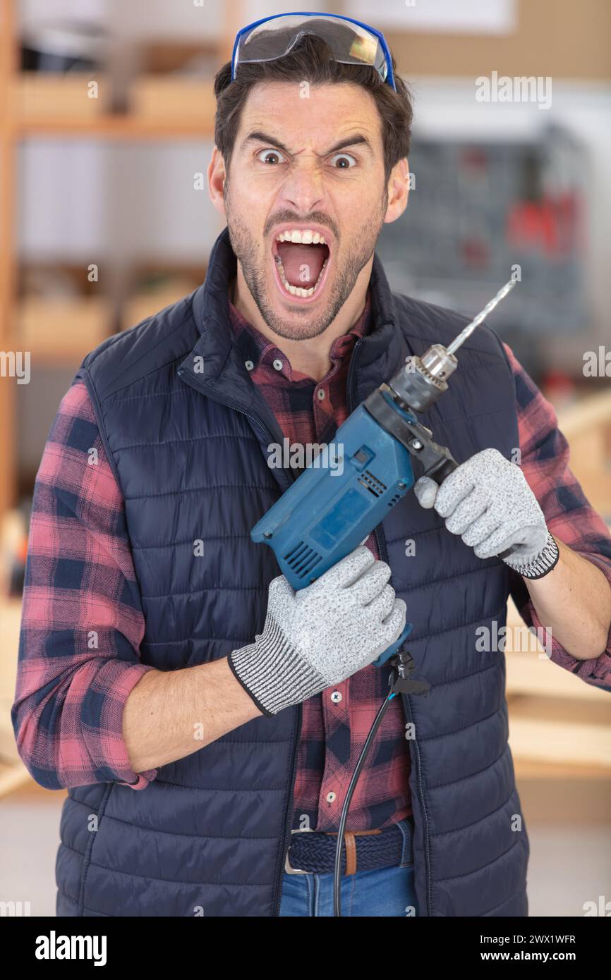 Angry construction worker holding hi-res stock photography and images ...
