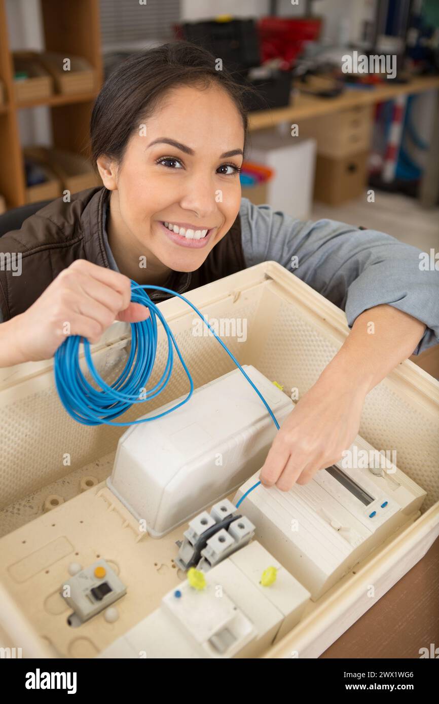 woman fixing electrics fuse box Stock Photo - Alamy
