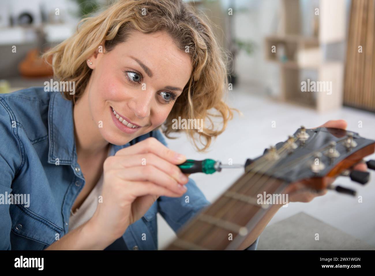 guitar production and repair at luthiers workshop Stock Photo - Alamy