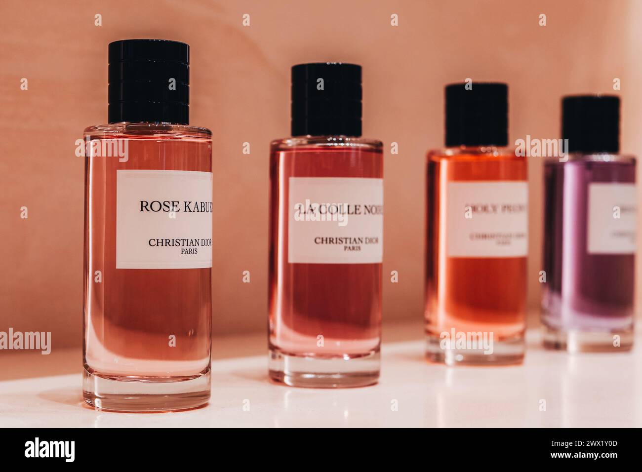 Classic female perfume Christian Dior, display of glass pink and red ...