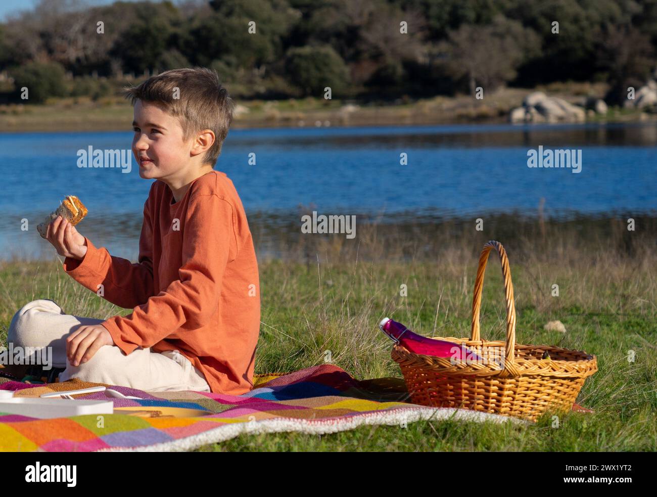 Happy boy having a picnic in nature Stock Photo - Alamy