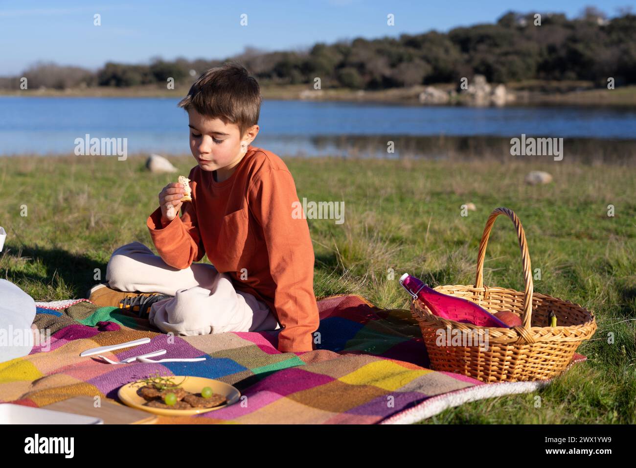 Boy having a picnic in nature Stock Photo - Alamy