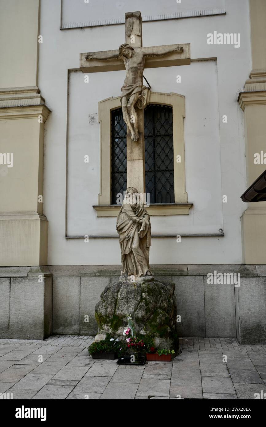 Virgin Mary and Crucifix statue Stock Photo - Alamy