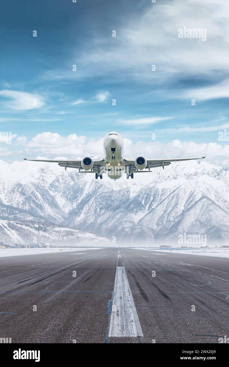 Airplane landing mountains on background hi-res stock photography and ...