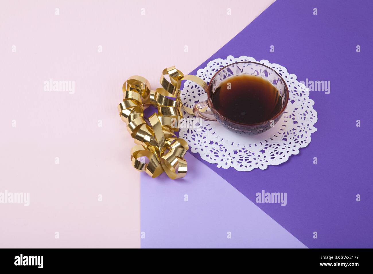 a violet cube made with colored paper to create a 3D optical illusion ...