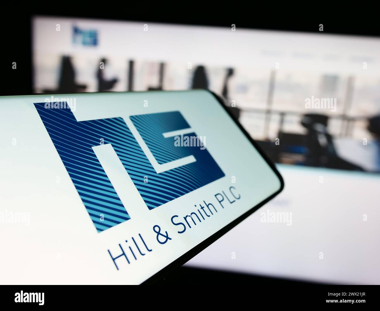 Mobile phone with logo of British infrastructure company Hill and Smith ...