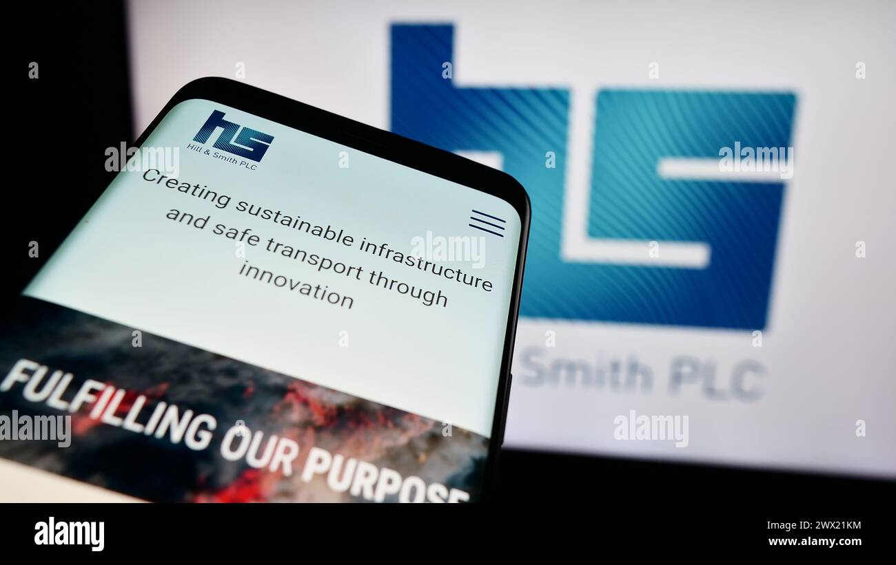 Smartphone with webpage of British infrastructure company Hill and ...