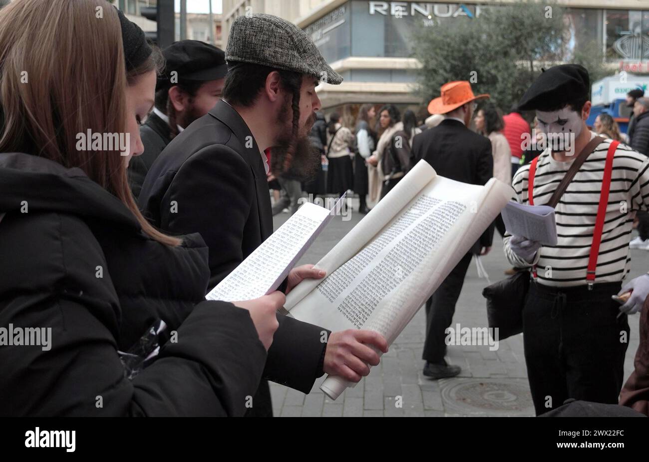 Israelis wearing costumes read the Book of Esther which tells the story ...