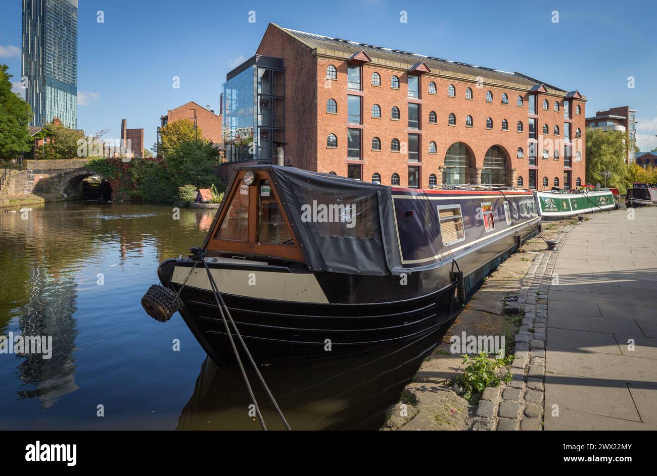 Merchants Warehouse in Castlefield, Manchester with canal boats moored ...