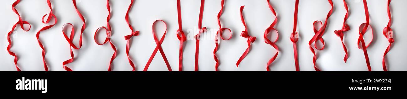 Collection of red strips of fabric with various shapes with bows and ...