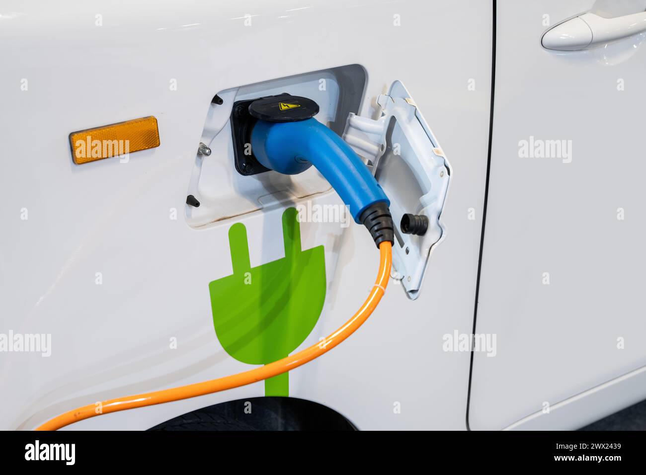 Close up of electric car inlet with a connected charging cable Stock ...