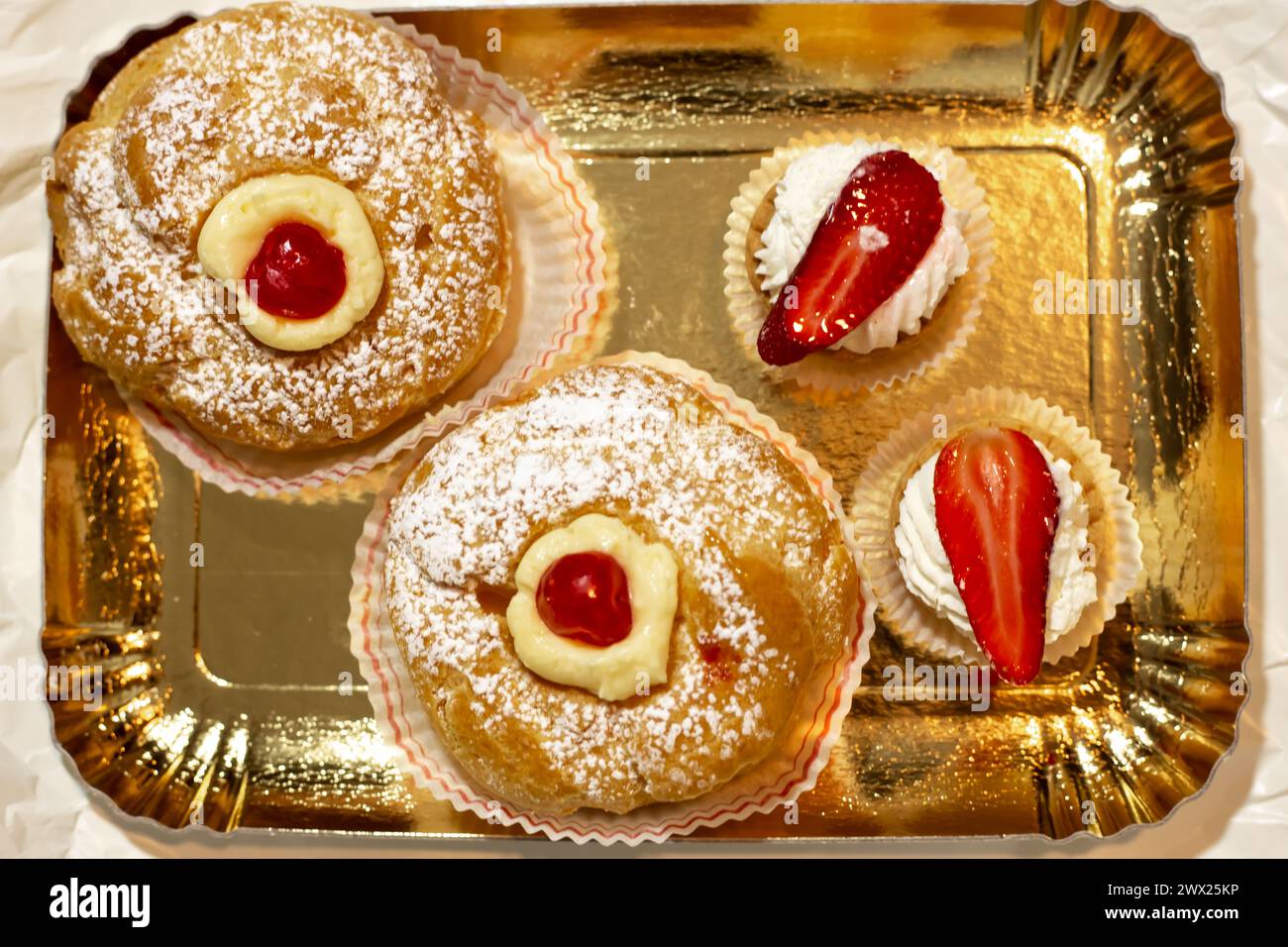 Italian dessert Zeppole di San Giuseppe, zeppola baked puffs made from ...