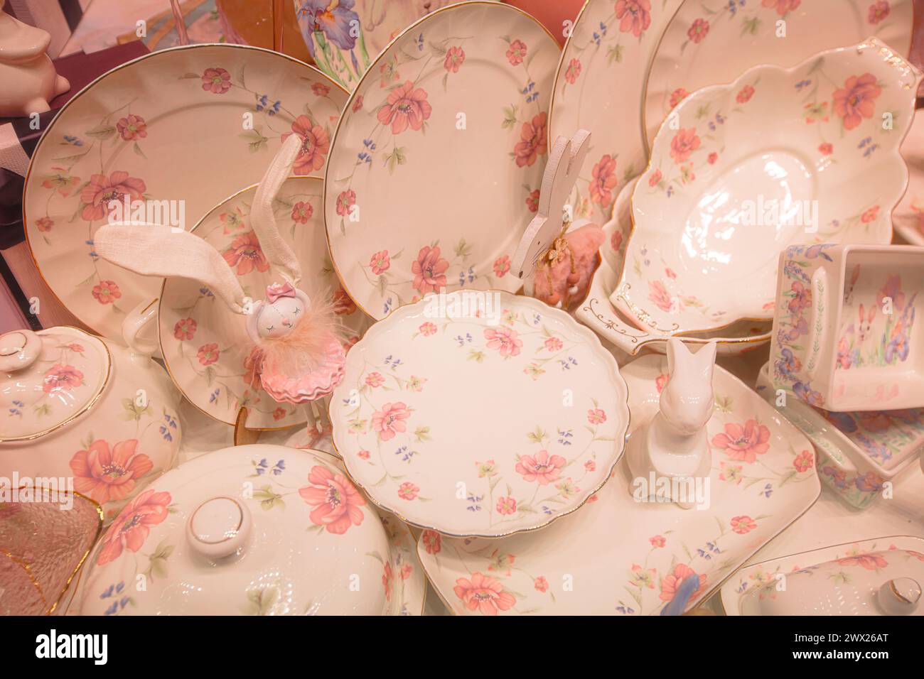 porcelain dishware set with floral design in the shop Stock Photo - Alamy