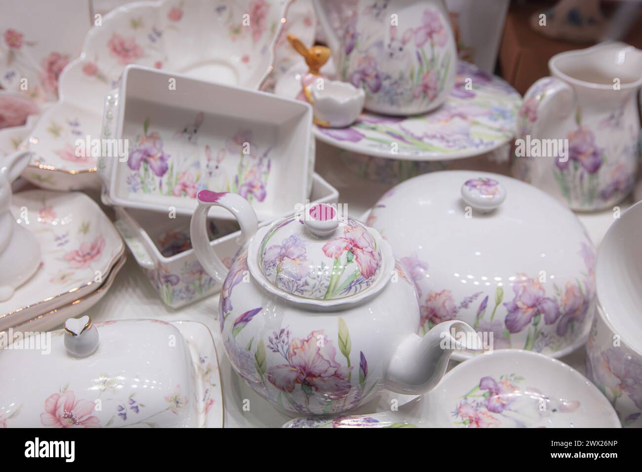 porcelain dishware set with floral design in the shop Stock Photo - Alamy