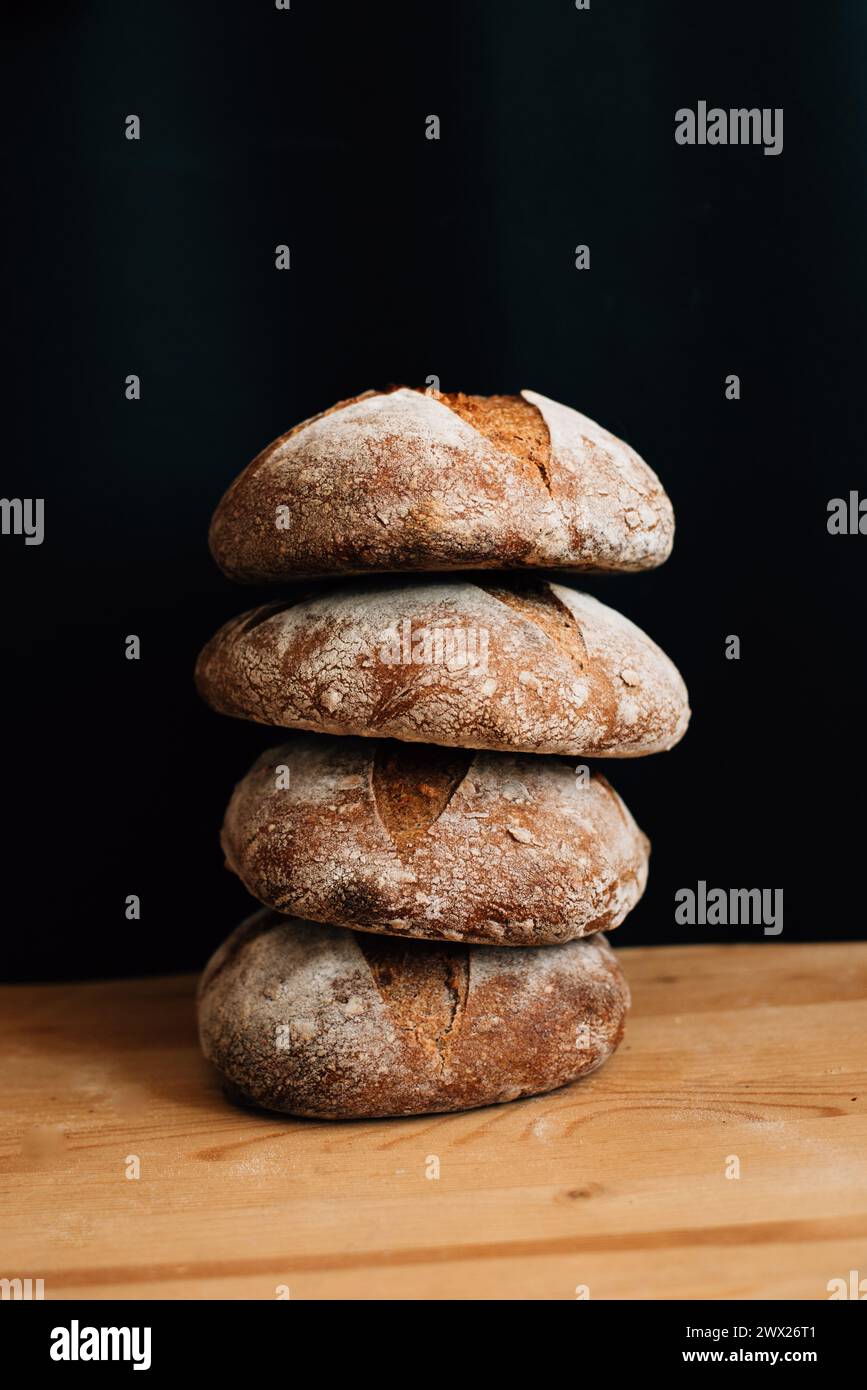 loaves of homemade black bread one on the other Stock Photo - Alamy