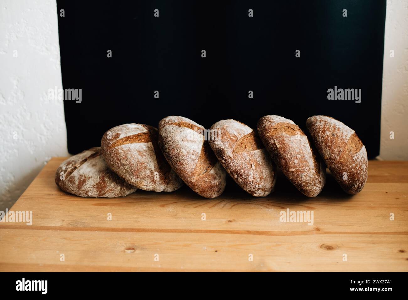 six loaves of homemade black bread Stock Photo - Alamy