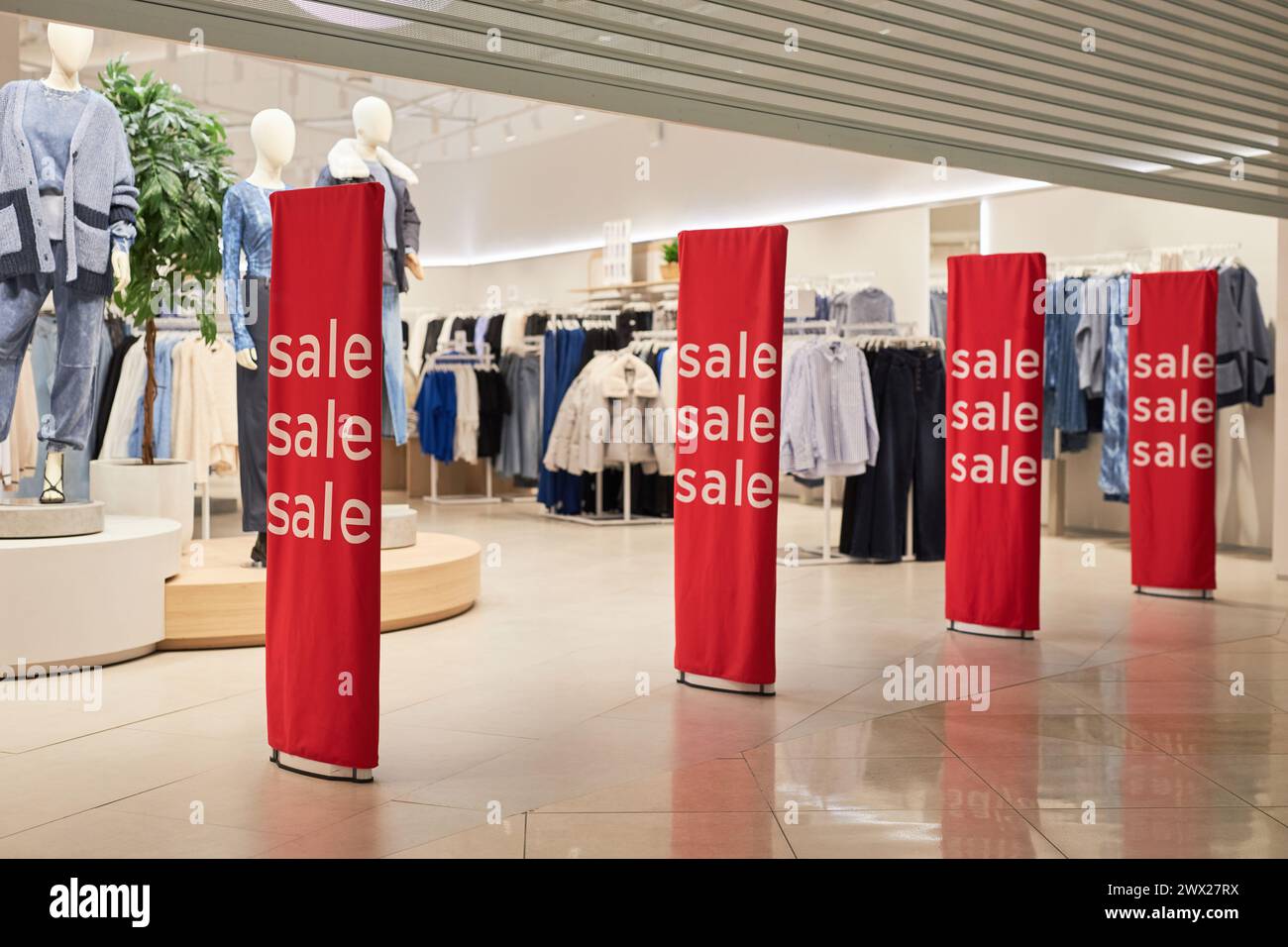 Background image of storefront with sale signs in shopping mall ...